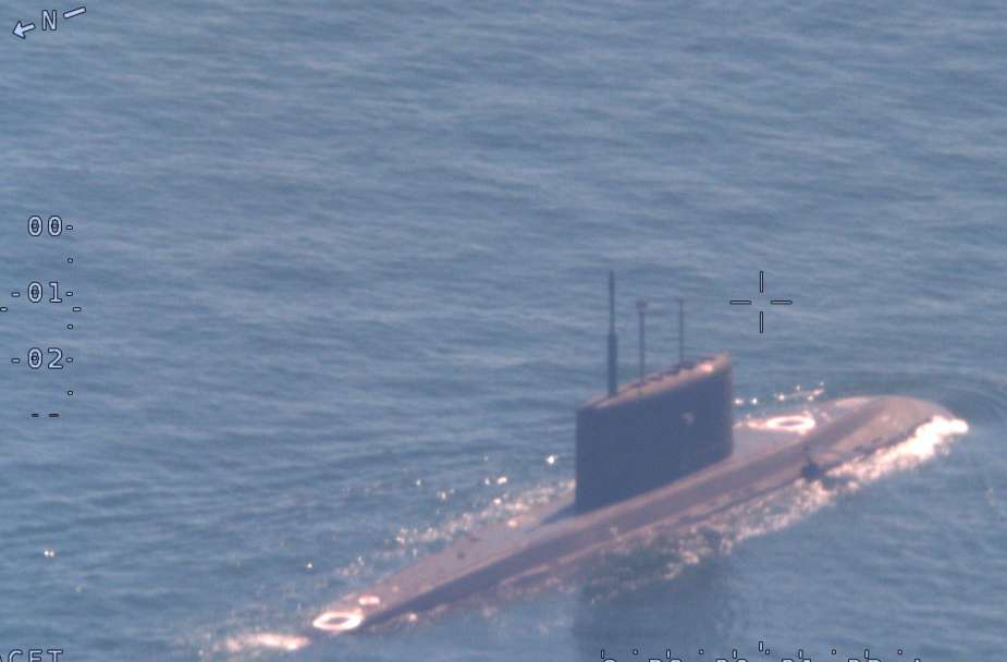 NATO Releases Striking Images of Russian Submarine in Baltic Sea ...